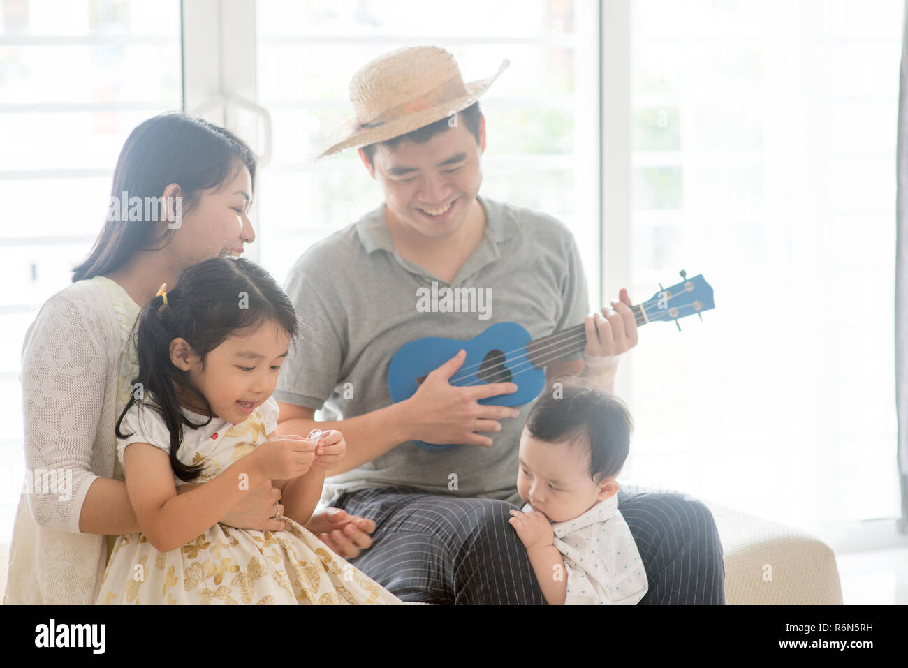 Chinese kids playing musical instrument hi-res stock photography and ...
