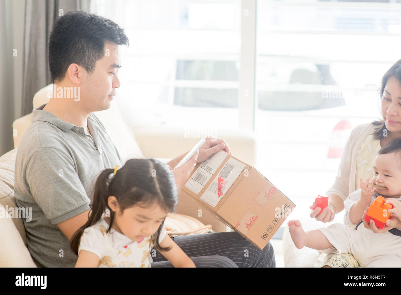 Father scanning QR code Stock Photo - Alamy