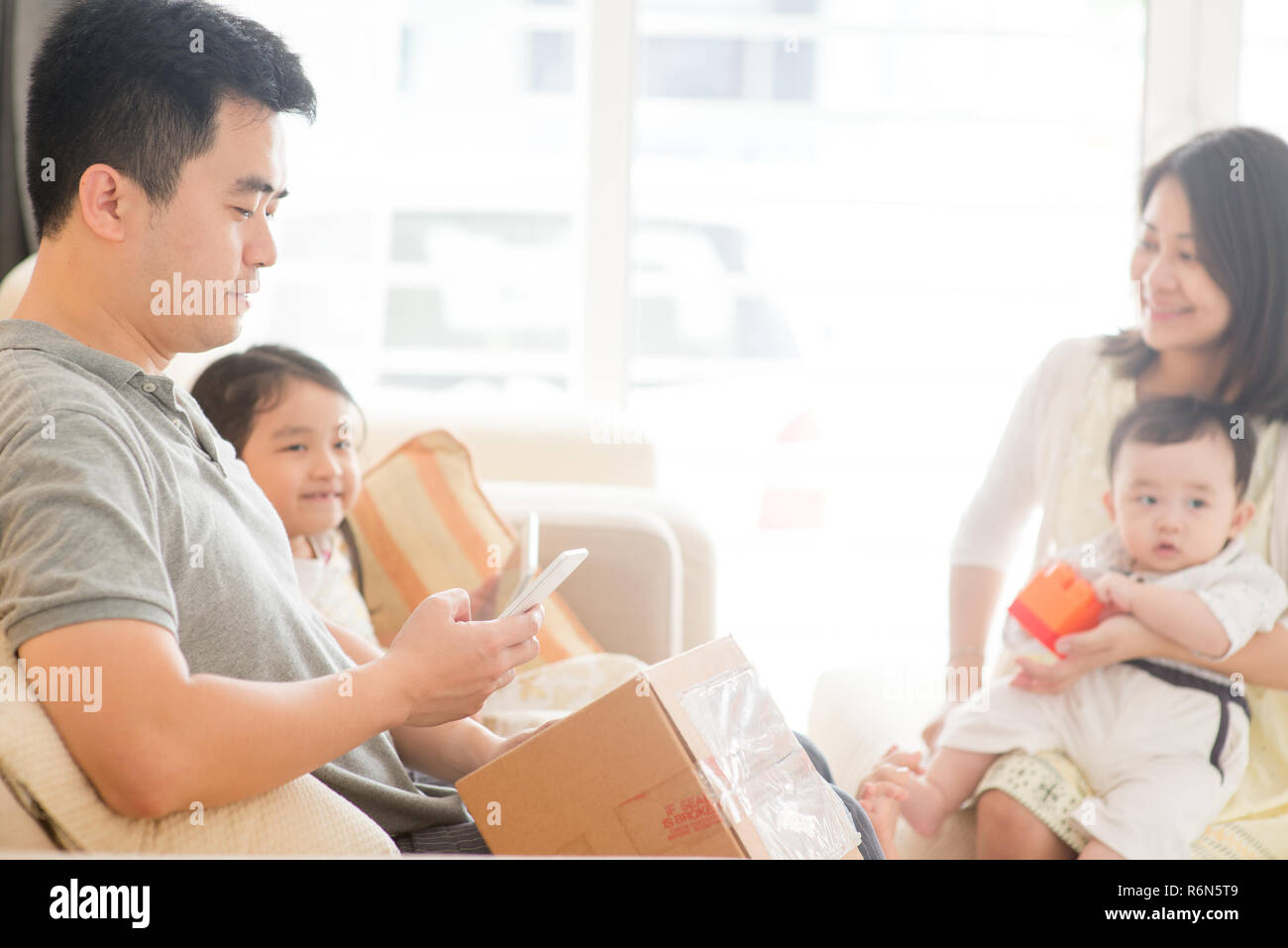 Chinese man scanning QR code Stock Photo - Alamy