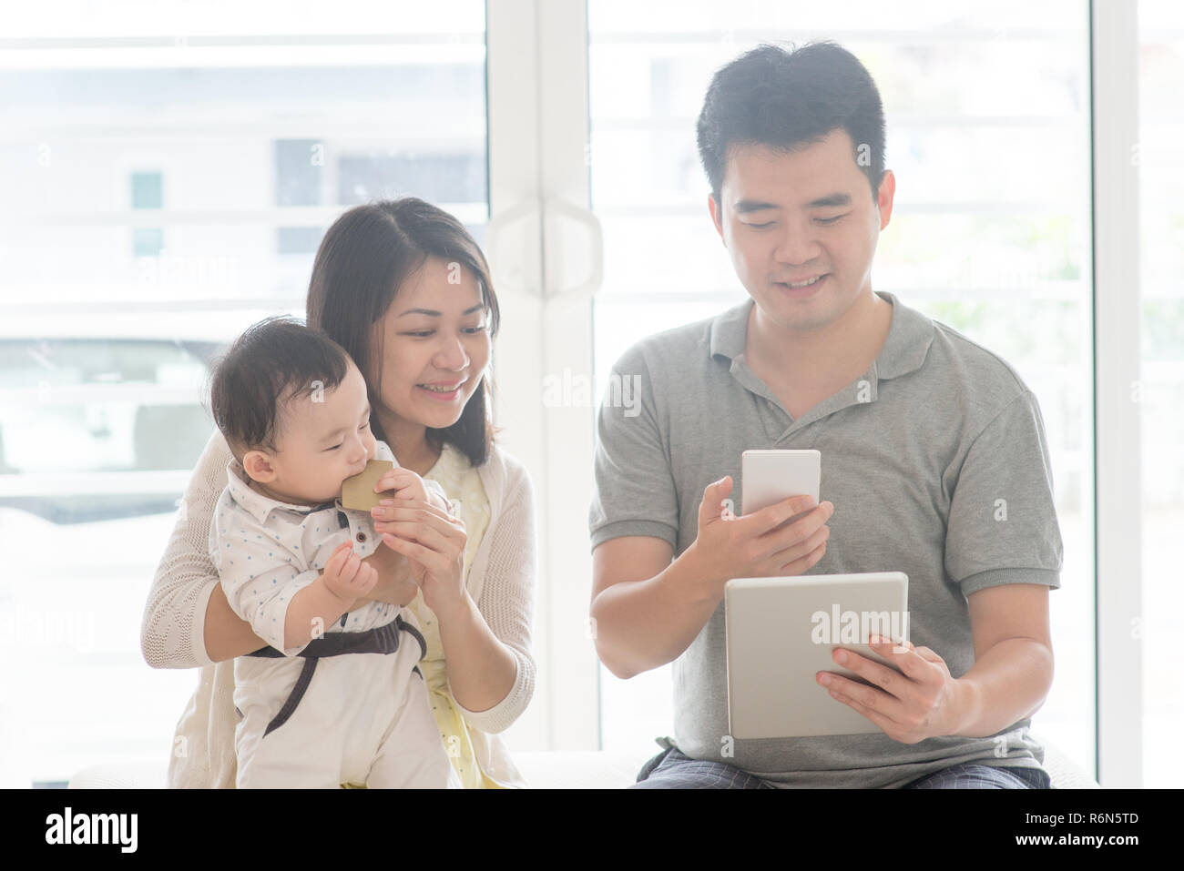 Chinese family scanning QR code Stock Photo - Alamy