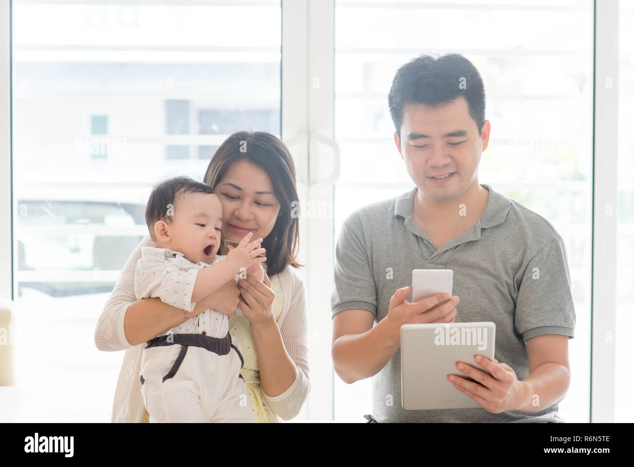 Family scanning QR code Stock Photo - Alamy