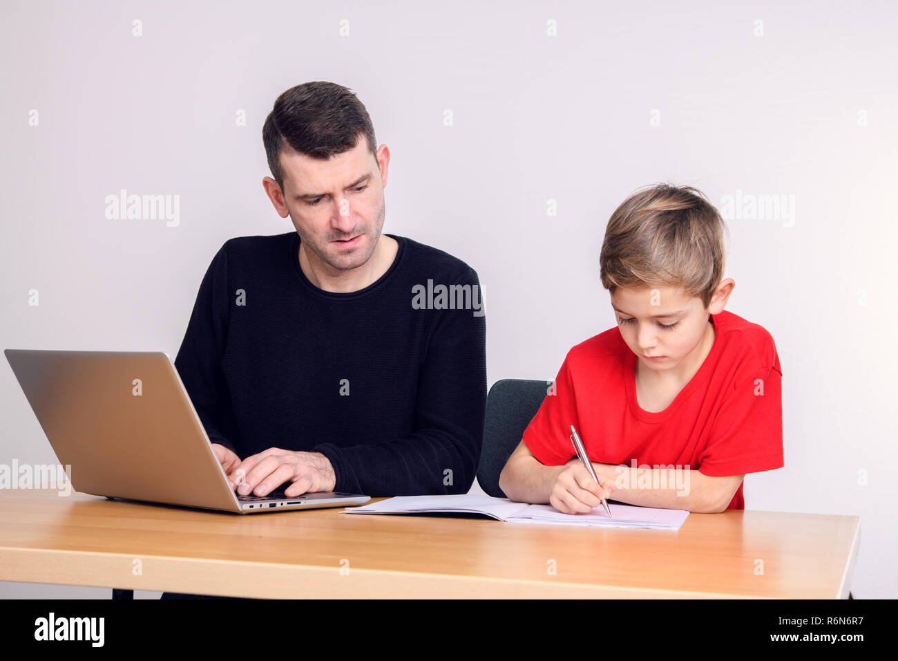 father and son using computer together Stock Photo - Alamy