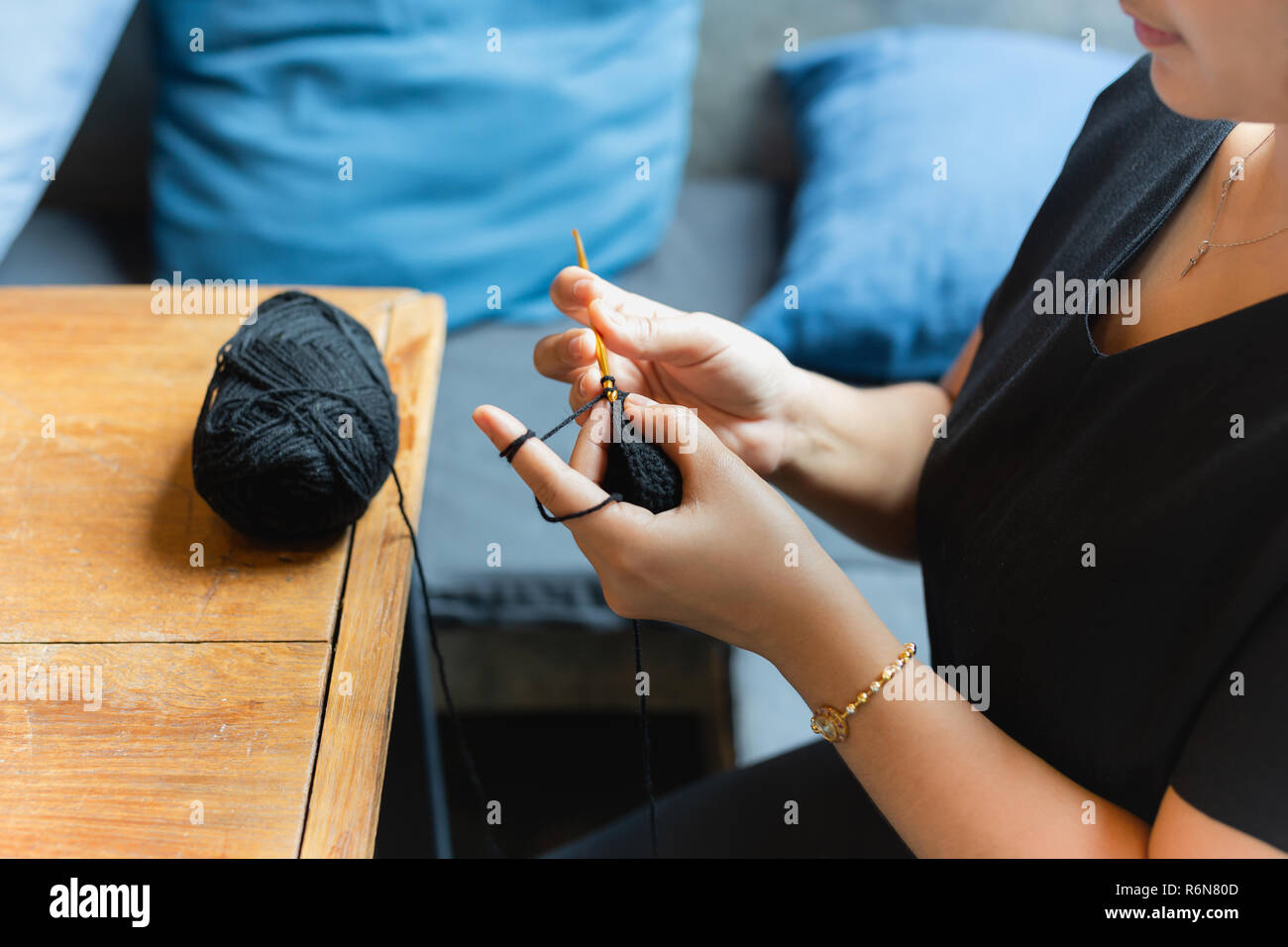 Woman's hands knitting crochet relaxing at cafe Stock Photo - Alamy