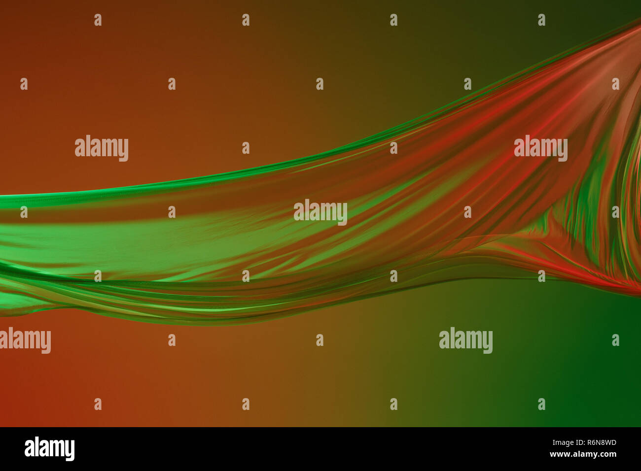 Smooth elegant transparent green cloth on green colored background ...