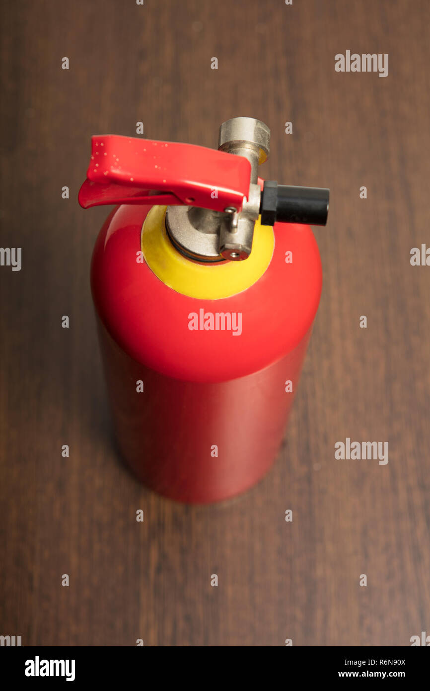 Top down view on a red fire extinguisher Stock Photo - Alamy