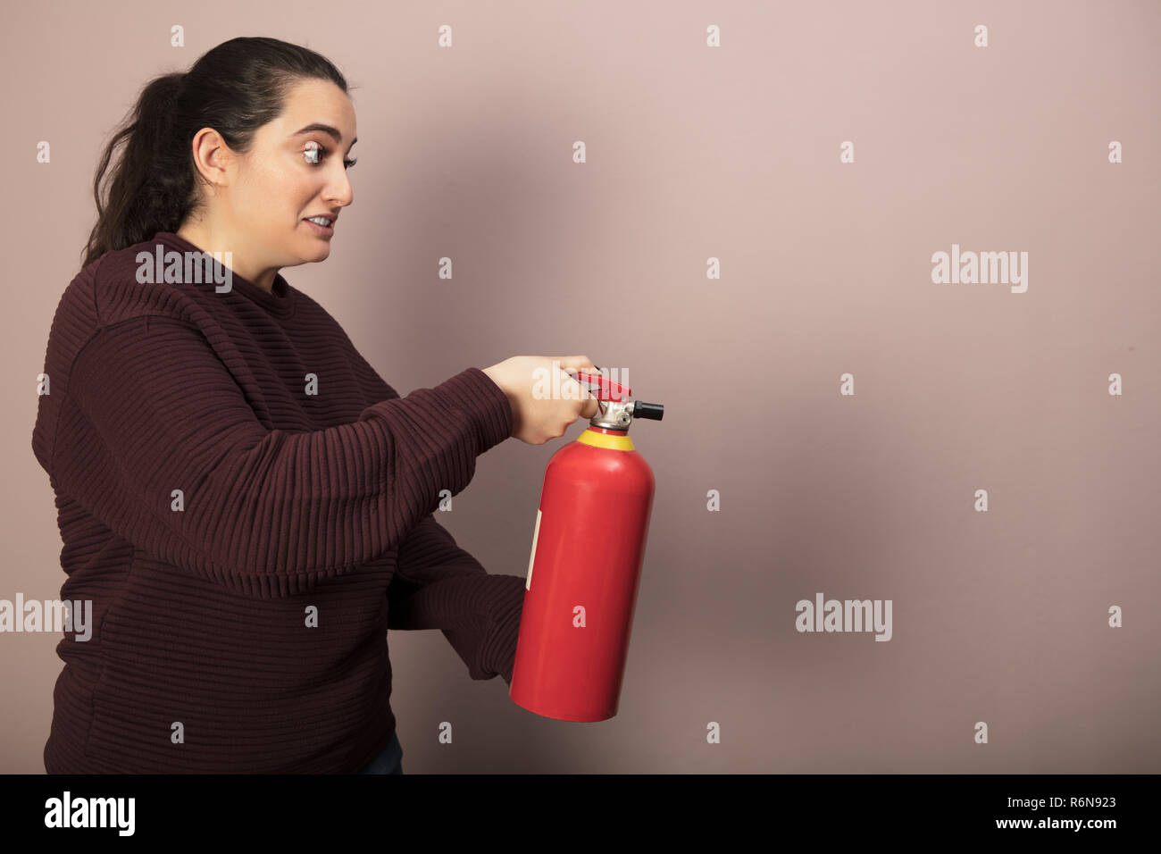 Beautiful woman fire extinguisher hi-res stock photography and images ...