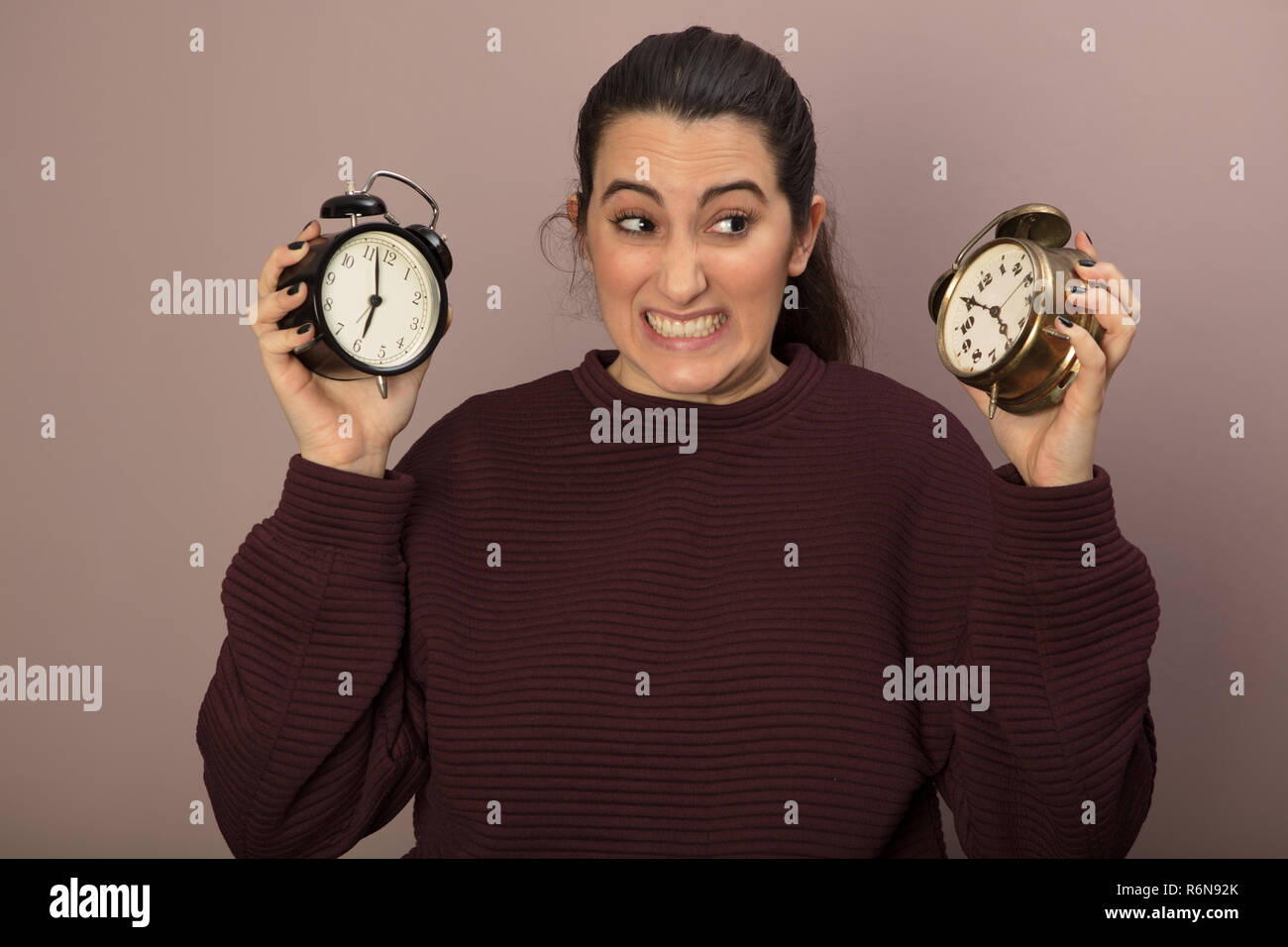 Frustrated young woman gnashing her teeth Stock Photo - Alamy