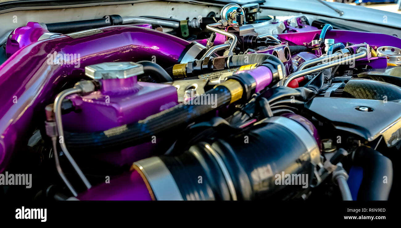 Detail of car engine components with purple tubes Stock Photo - Alamy