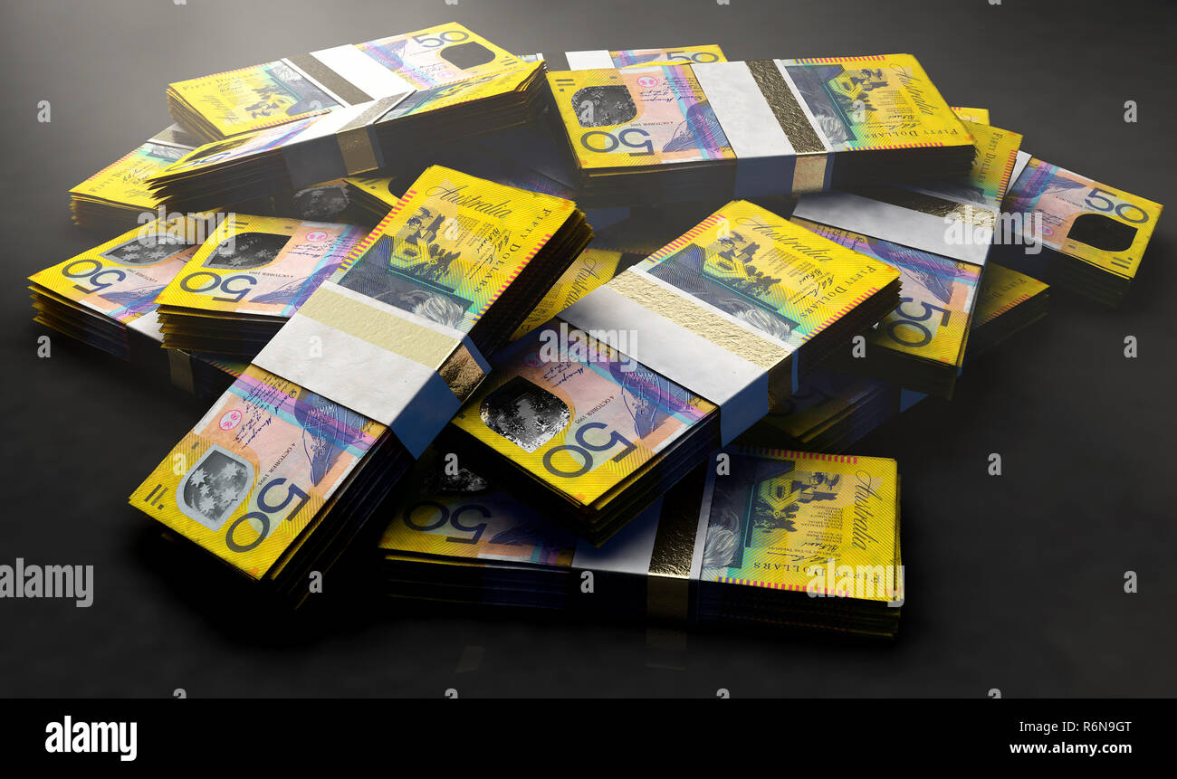 A pile of randomly scattered bundles of australian dollar banknotes on ...