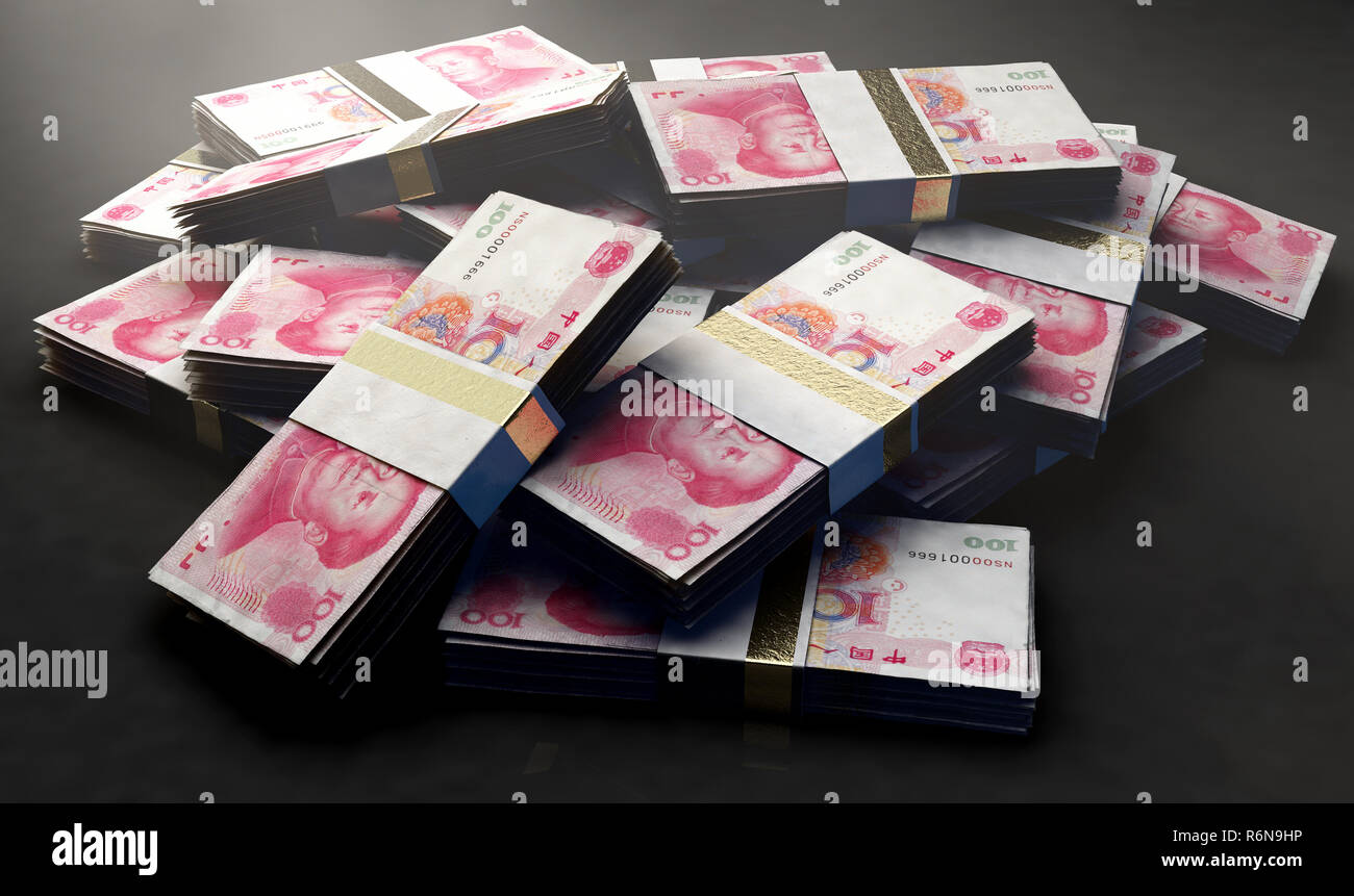 A pile of randomly scattered bundles of chinese yuan banknotes on an ...