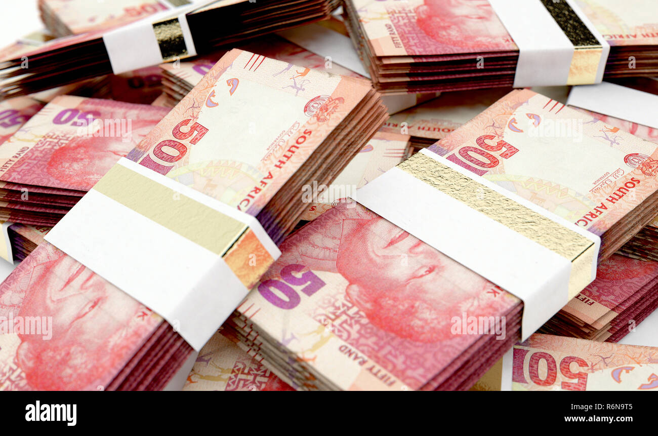A pile of randomly scattered bundles of south african rand banknotes on ...