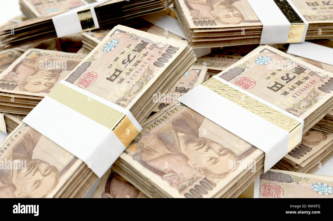 A pile of randomly scattered bundles of japanese yen banknotes on an ...