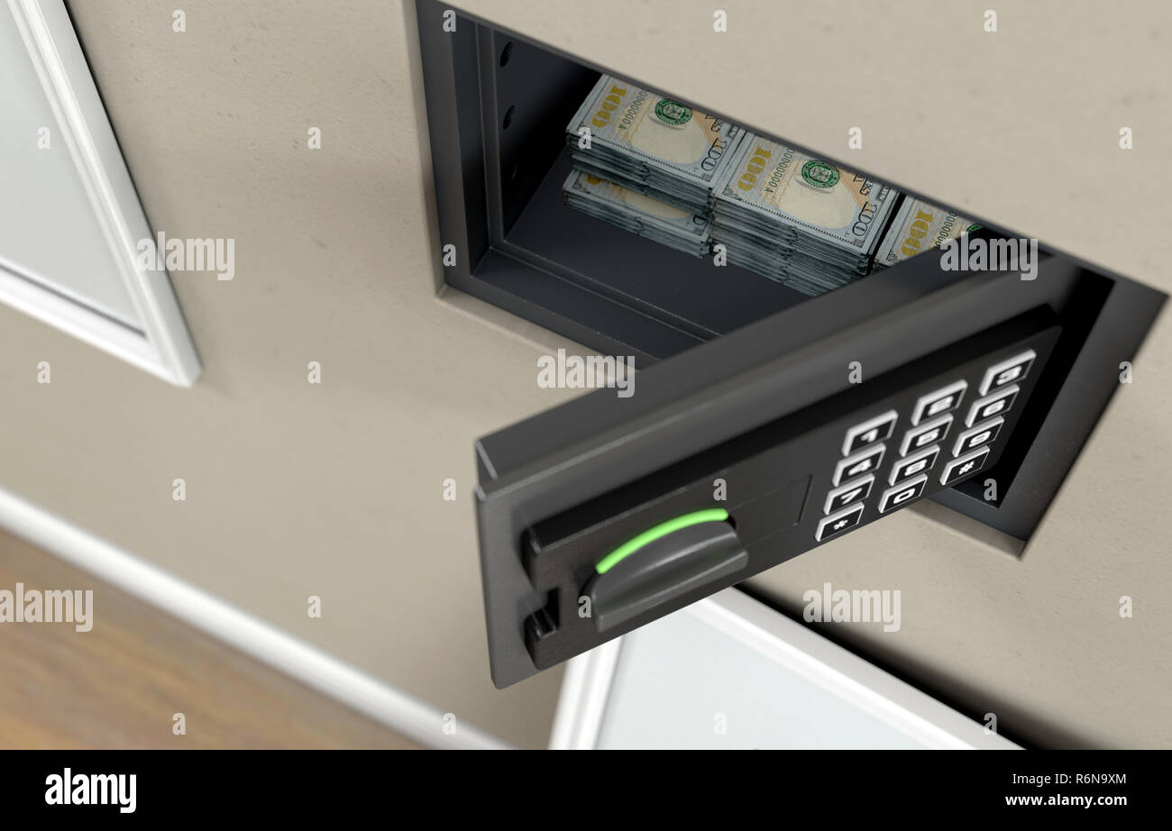 An open hidden wall safe with stacks of us dollar banknote piles ...