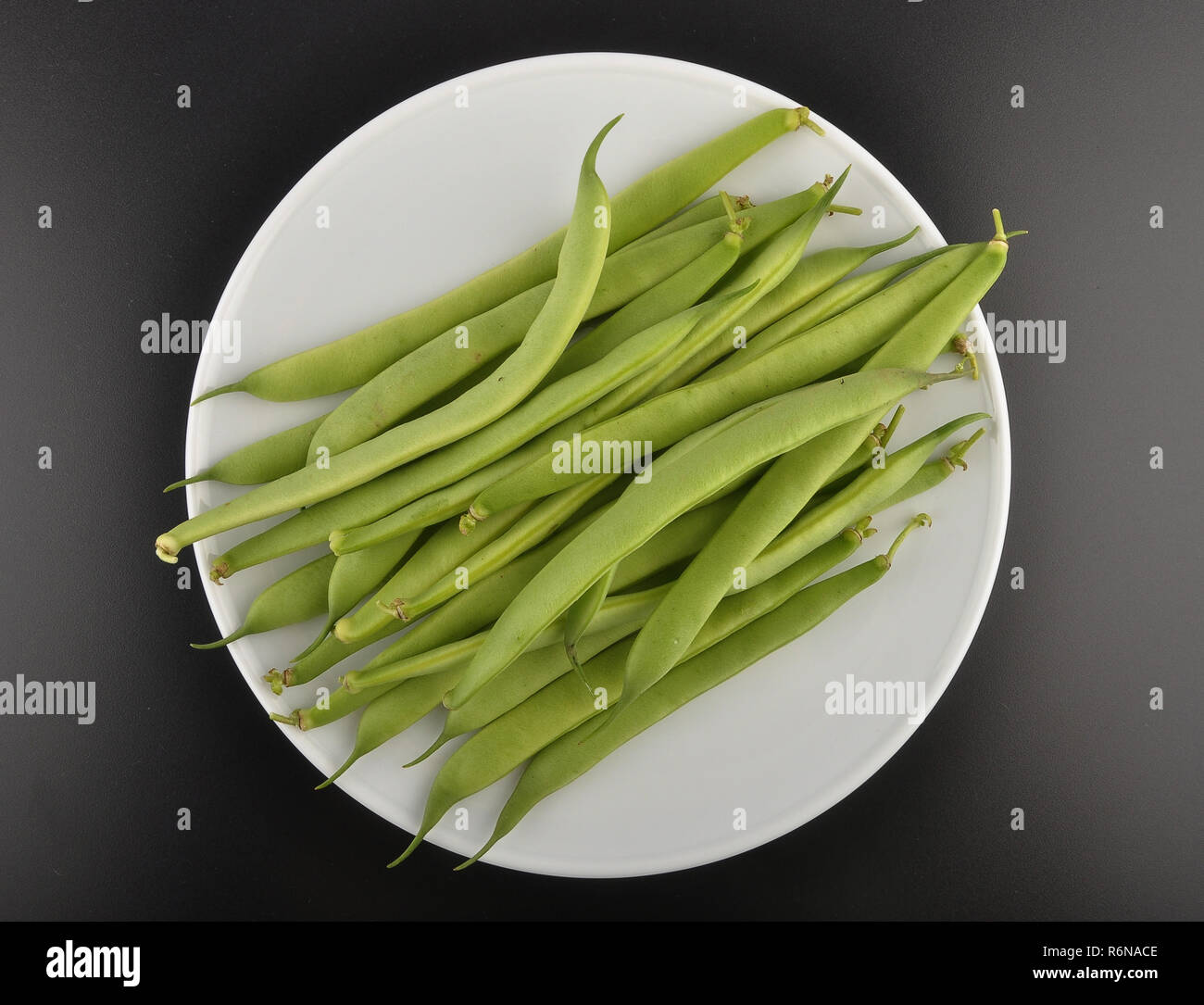 runner beans on dish Stock Photo - Alamy