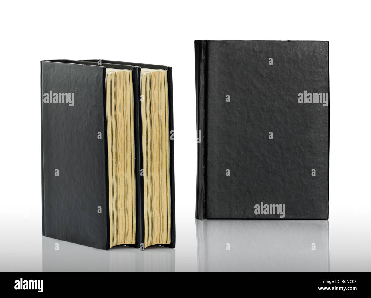 Closed black book is laying on white background Stock Photo - Alamy