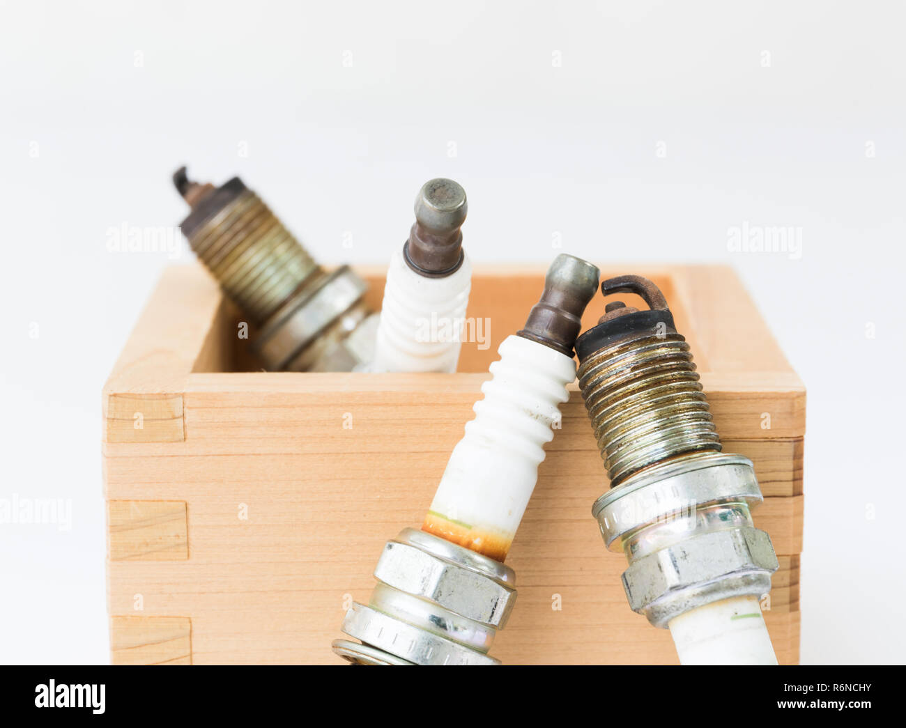 Spark plug in wood box Stock Photo - Alamy