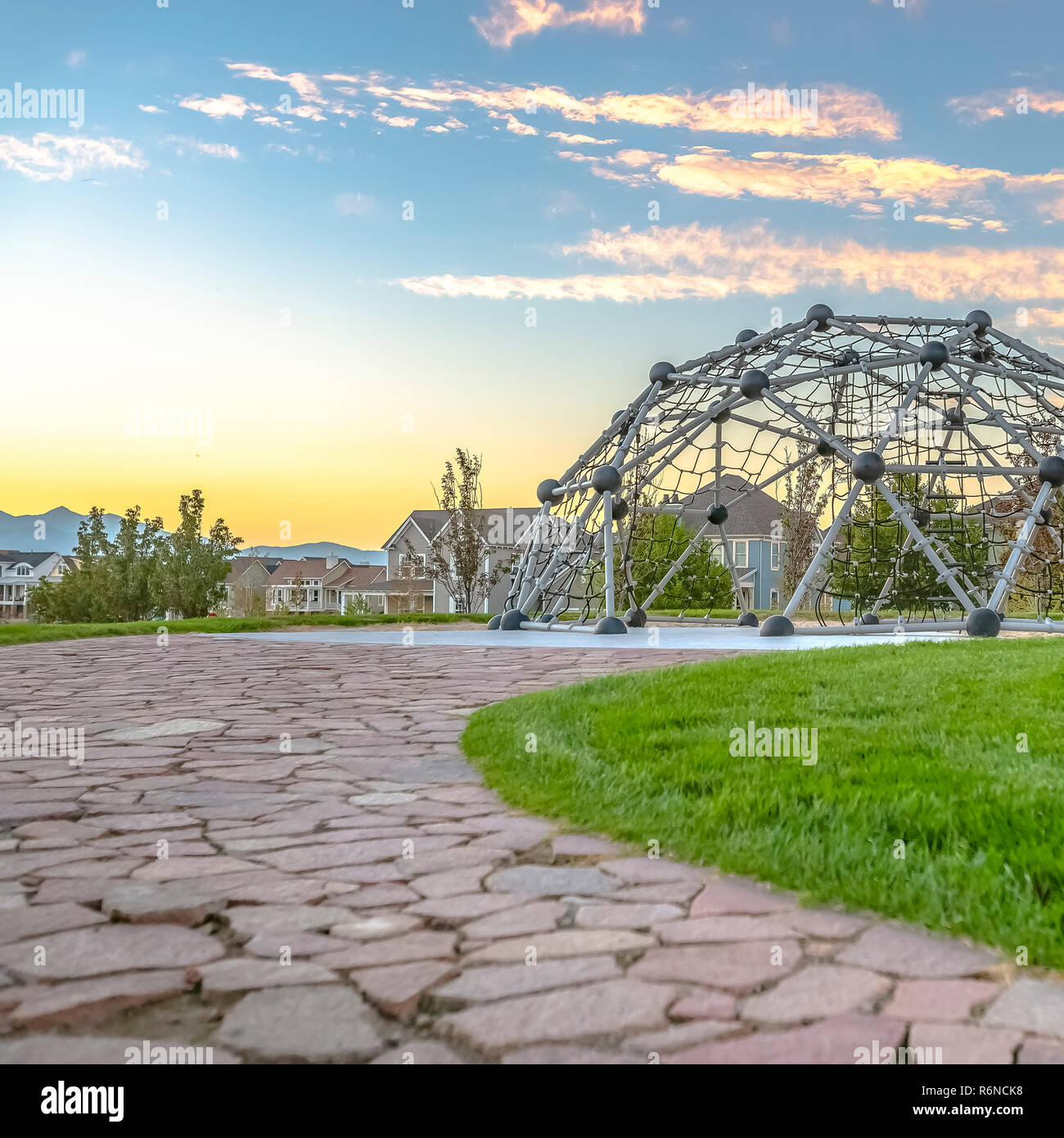 Dome climbing frame in Daybreak Utah at sunset Stock Photo - Alamy