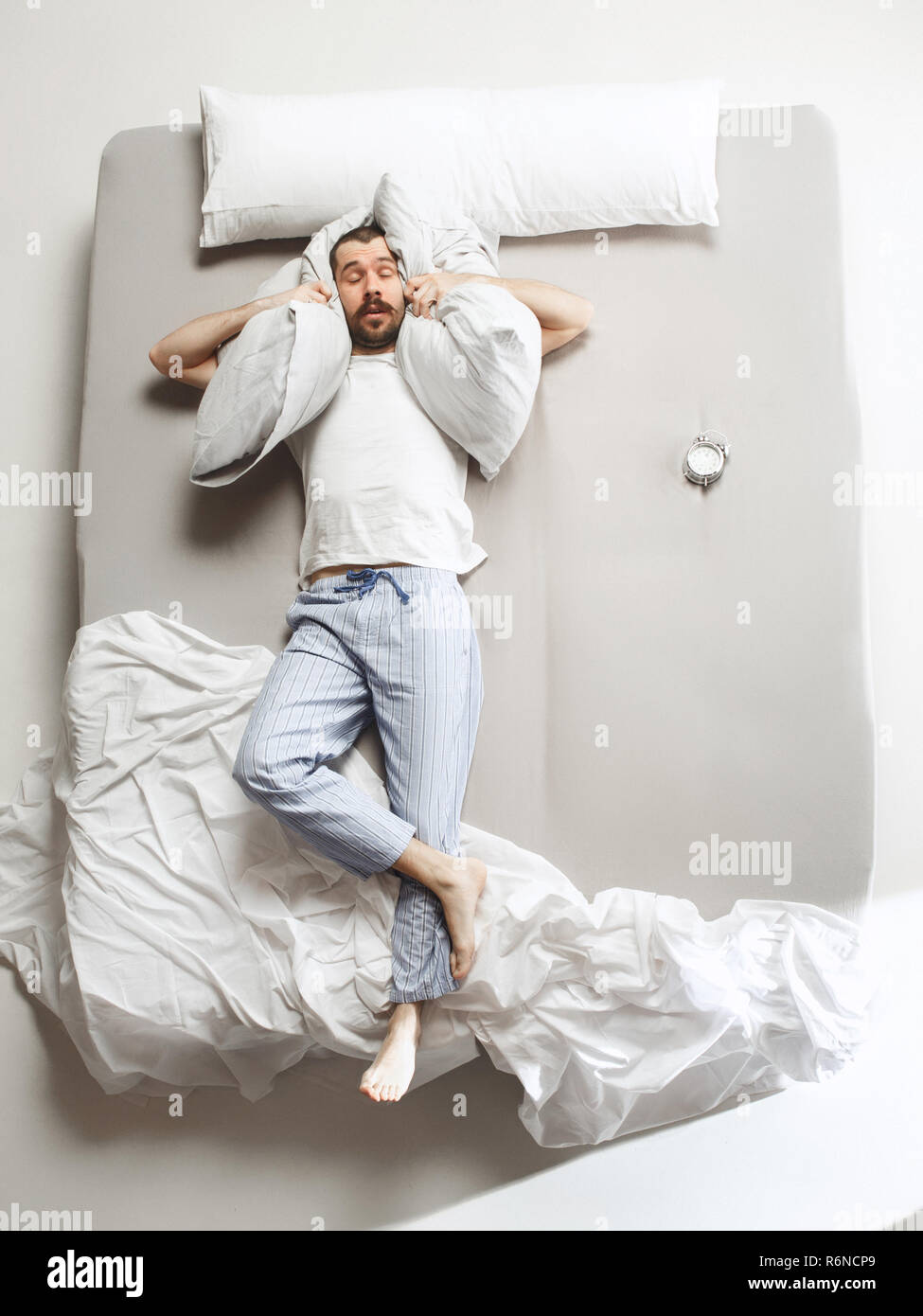 Top view photo of young man sleeping in a big white bed Stock Photo - Alamy