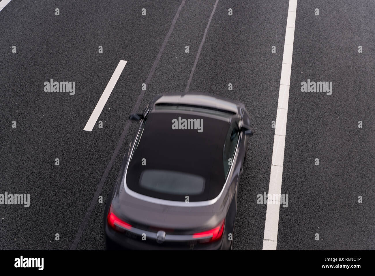 car on highway passing by Stock Photo - Alamy