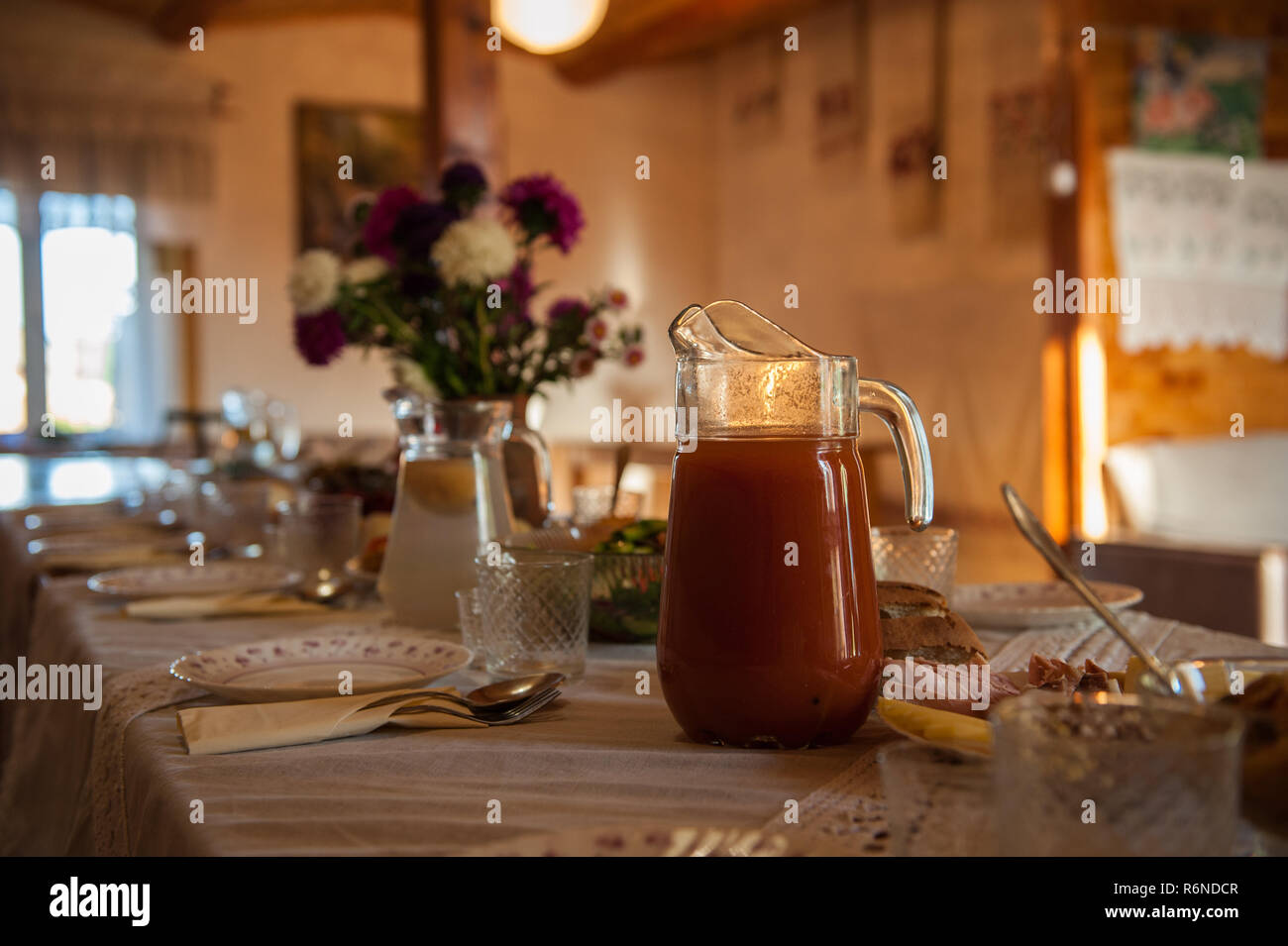 Decorated table with jug of juice Stock Photo - Alamy