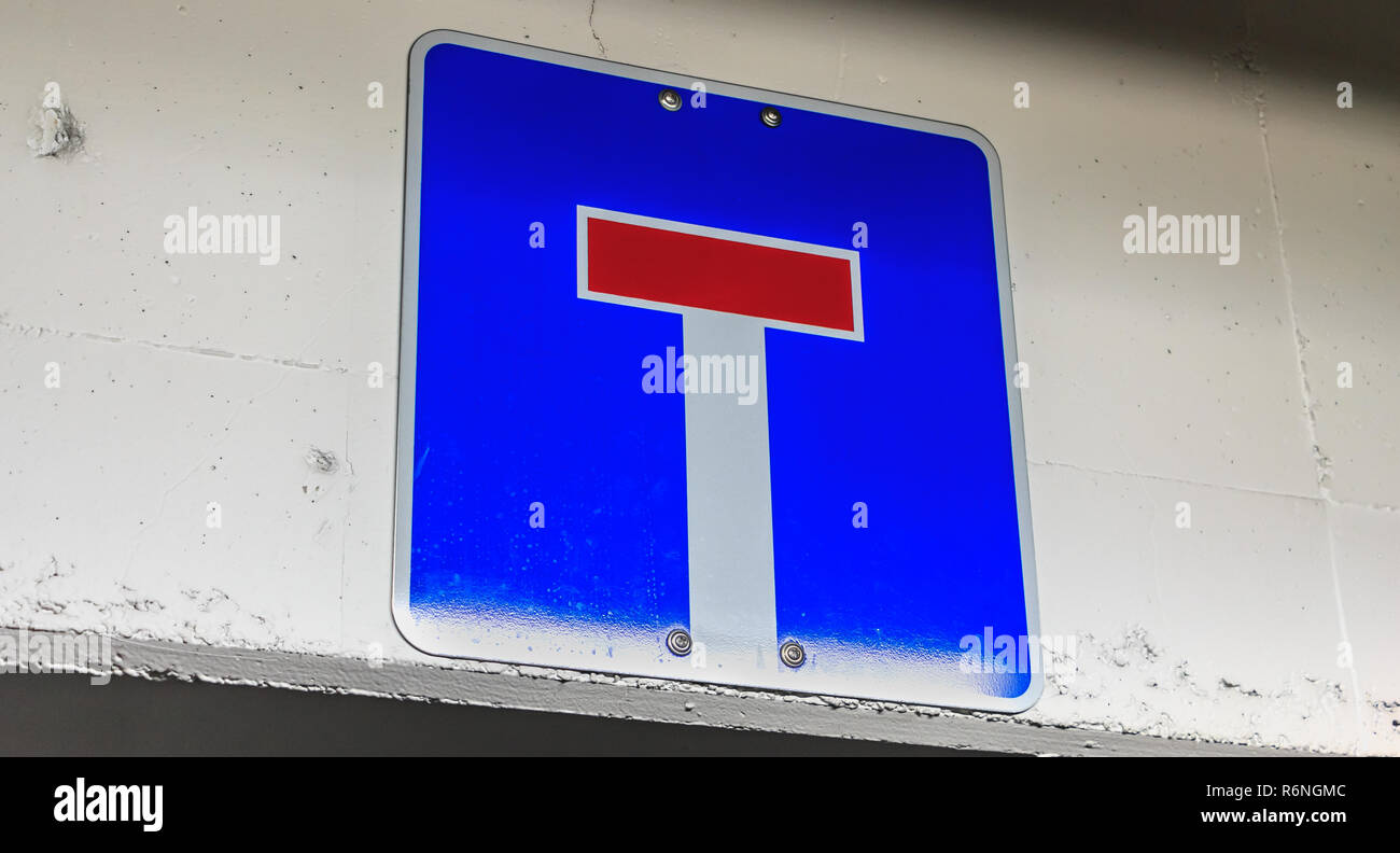 blue german dead end road sign hanging Stock Photo - Alamy