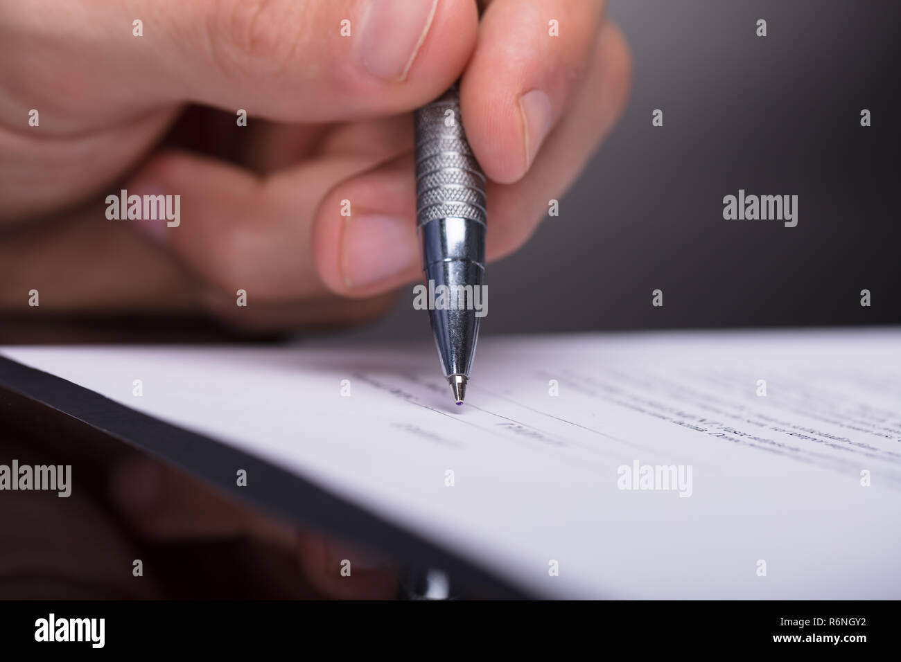 Businessperson Signing Document Stock Photo - Alamy