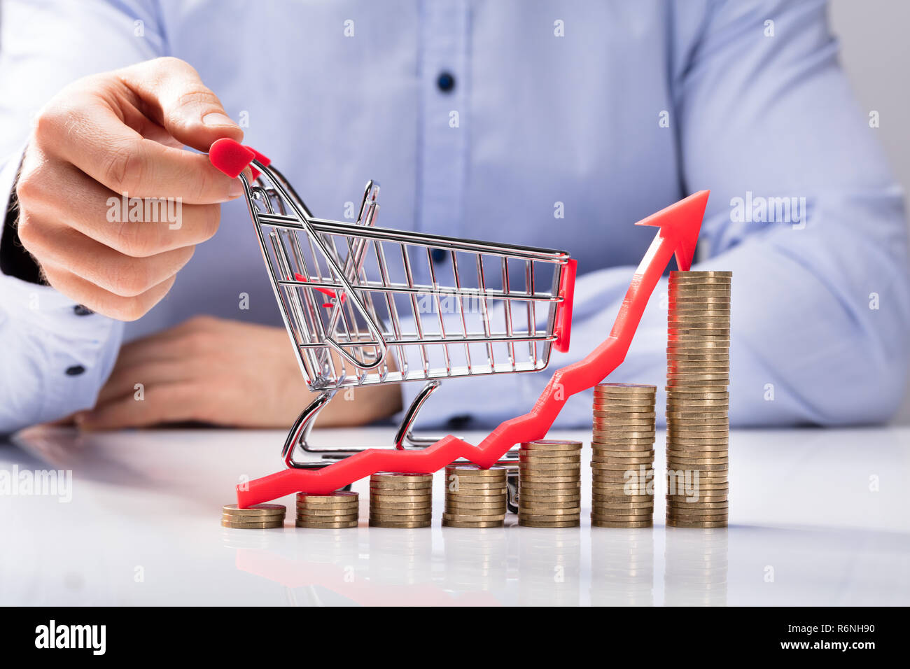 Human Hand Holding Small Shopping Cart Stock Photo - Alamy