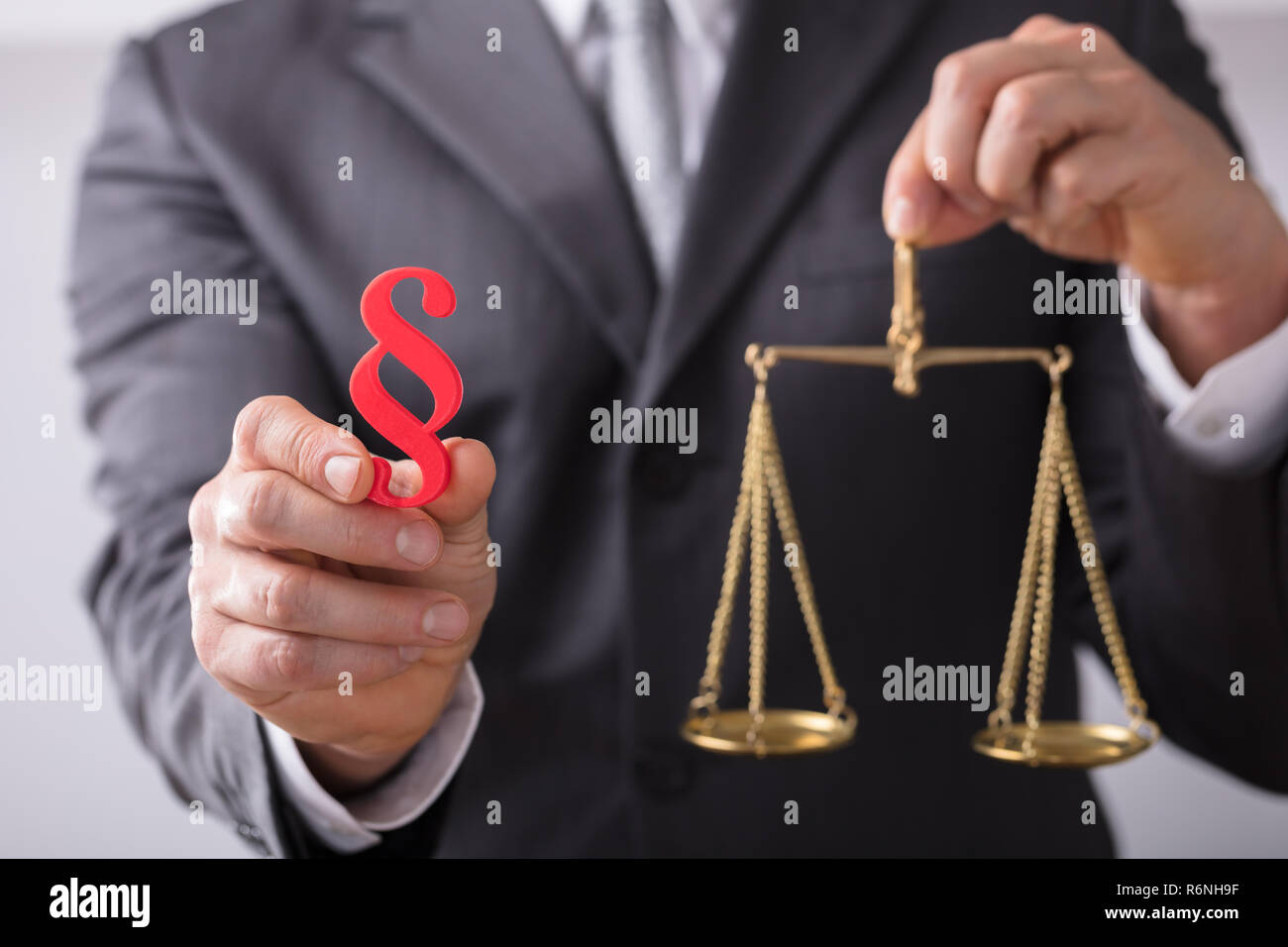 Judge Holding Paragraph Symbol And Justice Scale Stock Photo - Alamy