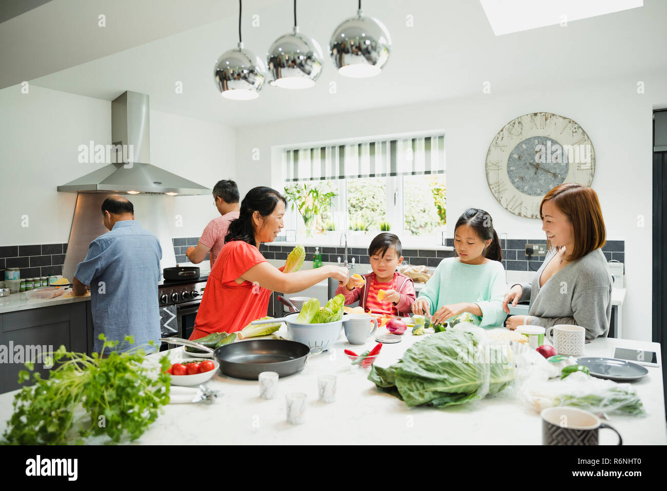 Small family preparing a dinner hi-res stock photography and images - Alamy