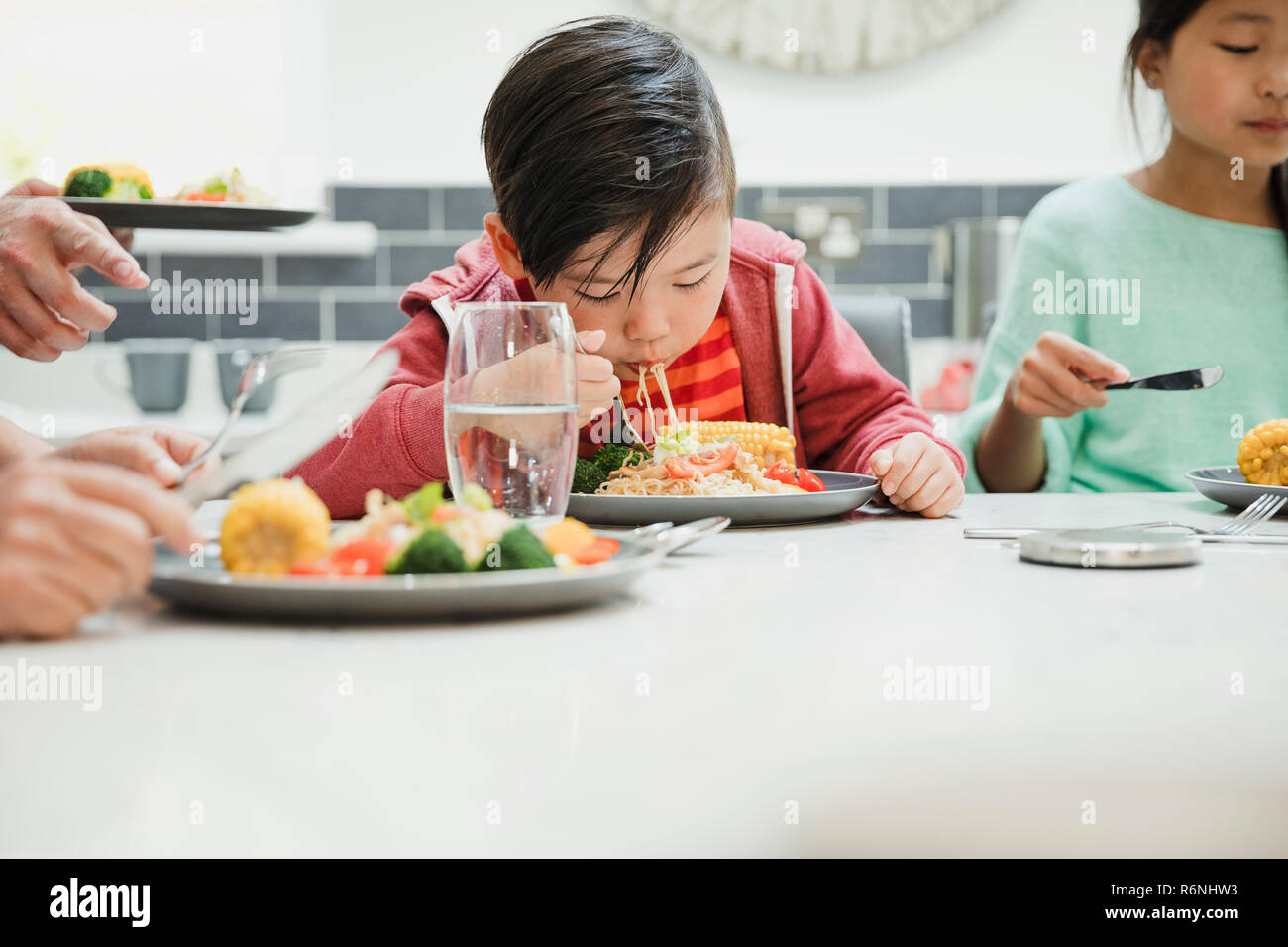 Little boy Enjoying his Noodle Stir Fry Stock Photo - Alamy