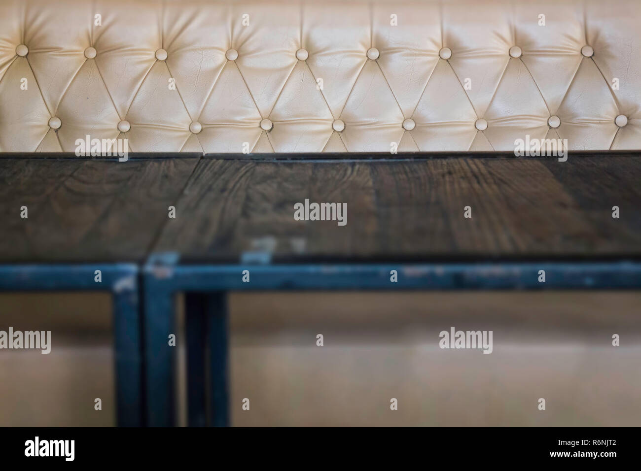 Empty table in vintage living room Stock Photo - Alamy