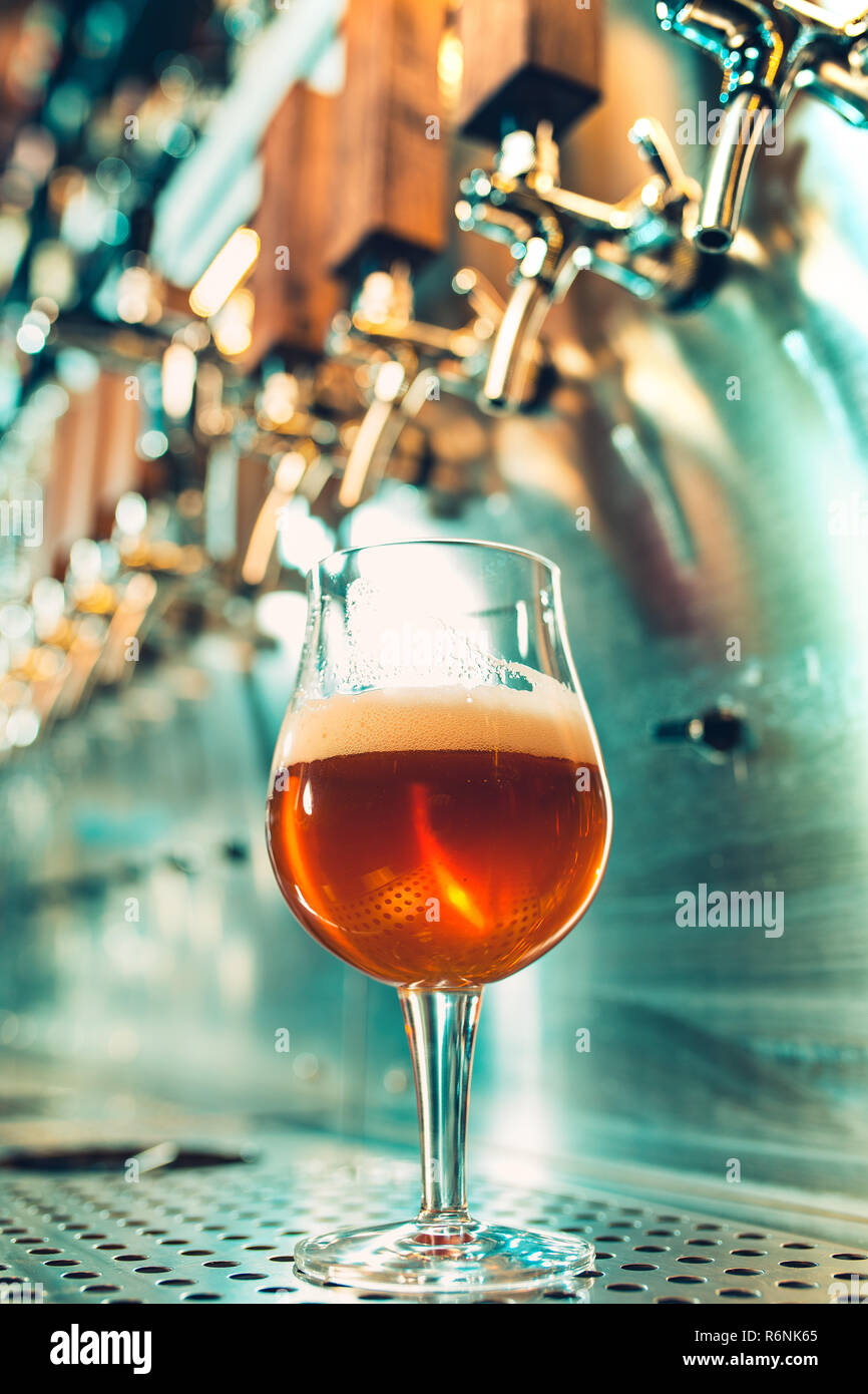 Beer craft. Bar table. Steel taps. Shiny taps. Glass of beer Stock ...