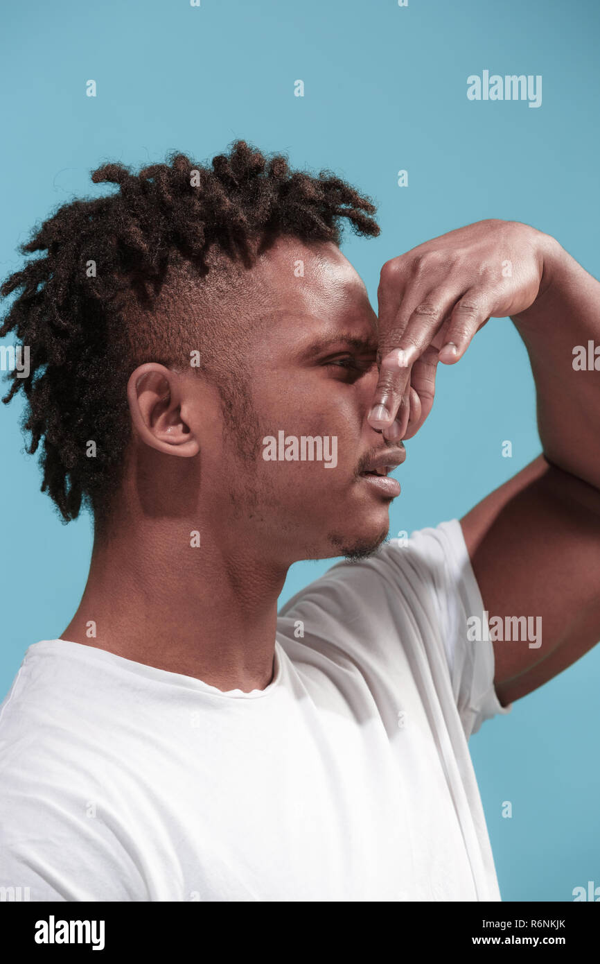 Young man with disgusted expression repulsing something, isolated on ...