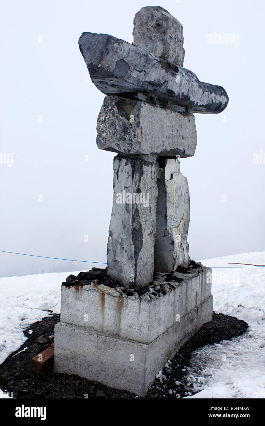 Inukshuk fog snow stone native sculpture symbol Canada cold Stock Photo ...