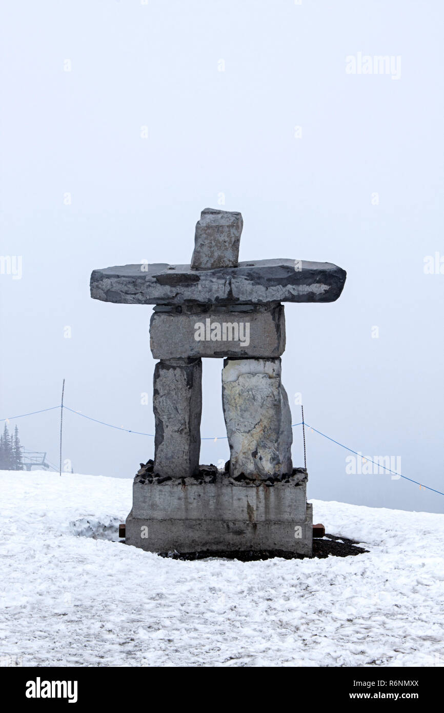 Inukshuk fog snow stone native sculpture symbol Canada Stock Photo - Alamy