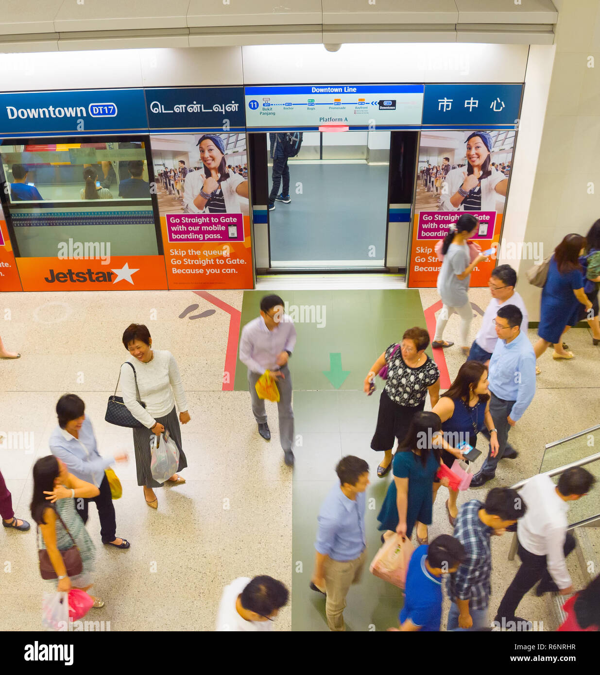 SINGAPORE - FEB 16, 2017: Passengers living a MRT train at a station ...
