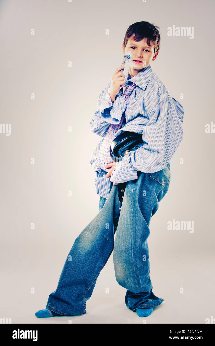 funny boy wearing Dad's clothes Stock Photo - Alamy