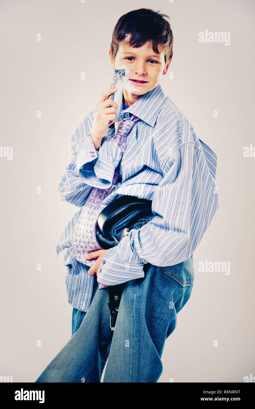 funny boy wearing Dad's clothes Stock Photo - Alamy