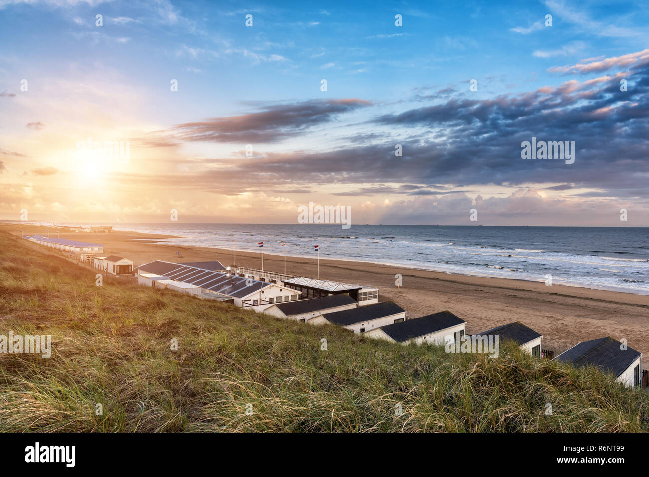 Colorful sunset over the sea and sandy beach in Netherlands, Katwijk ...