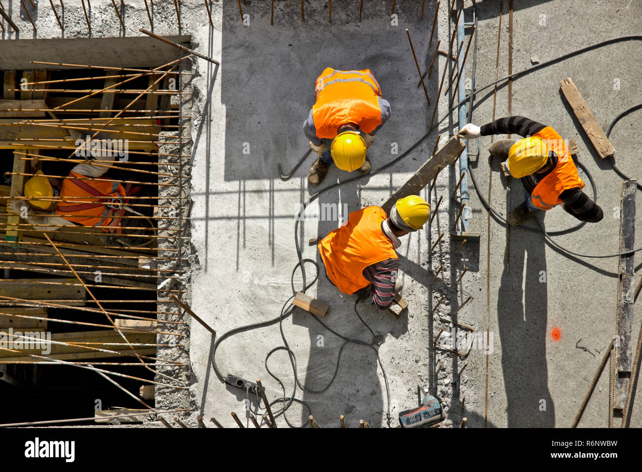 Construction site workers - aerial - Top View Stock Photo - Alamy