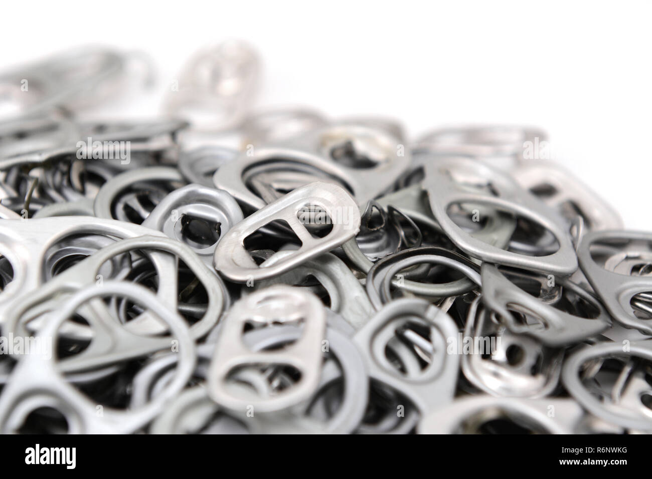 Heap of ring pulls with one pull tab in focus Stock Photo - Alamy