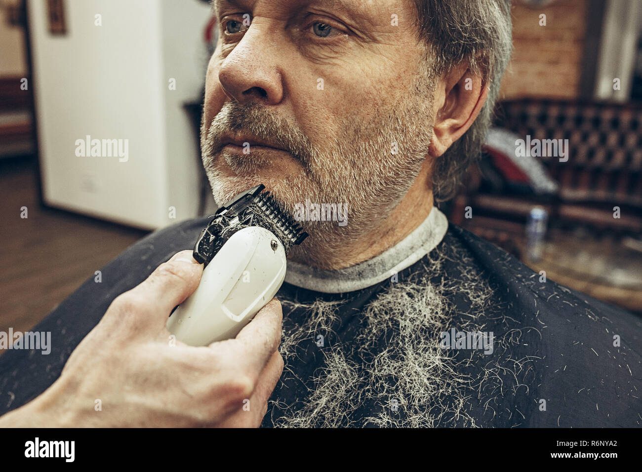 Close-up side view portrait of handsome senior bearded caucasian man ...