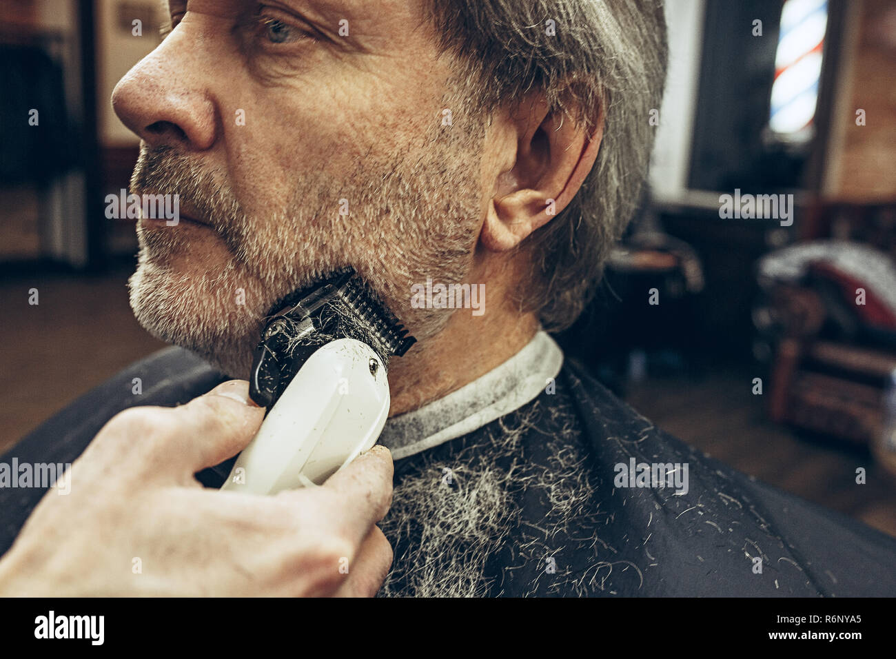 Close-up side view portrait of handsome senior bearded caucasian man ...