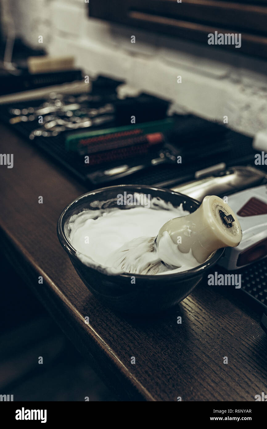Barber shop tools on the table. Close up view shaving foam Stock Photo ...