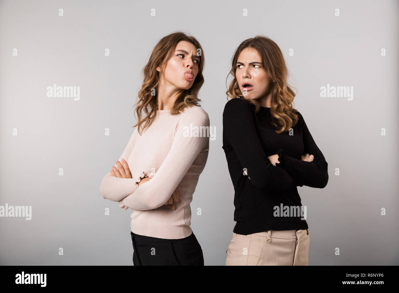 Two girls arms crossed back hi-res stock photography and images - Alamy