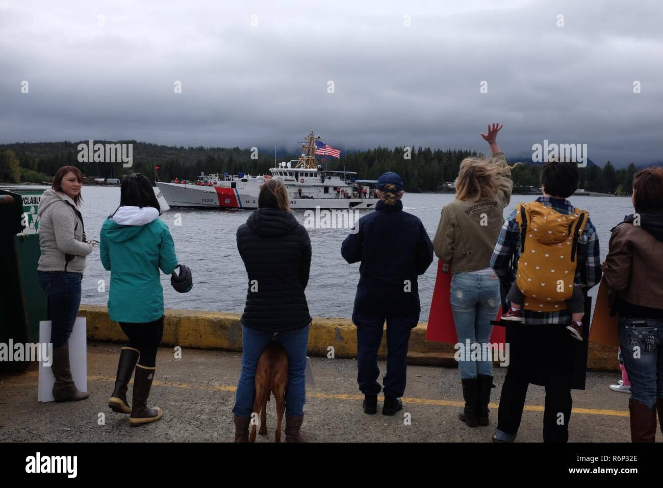 Families await the return of their loved ones stationed aboard the ...