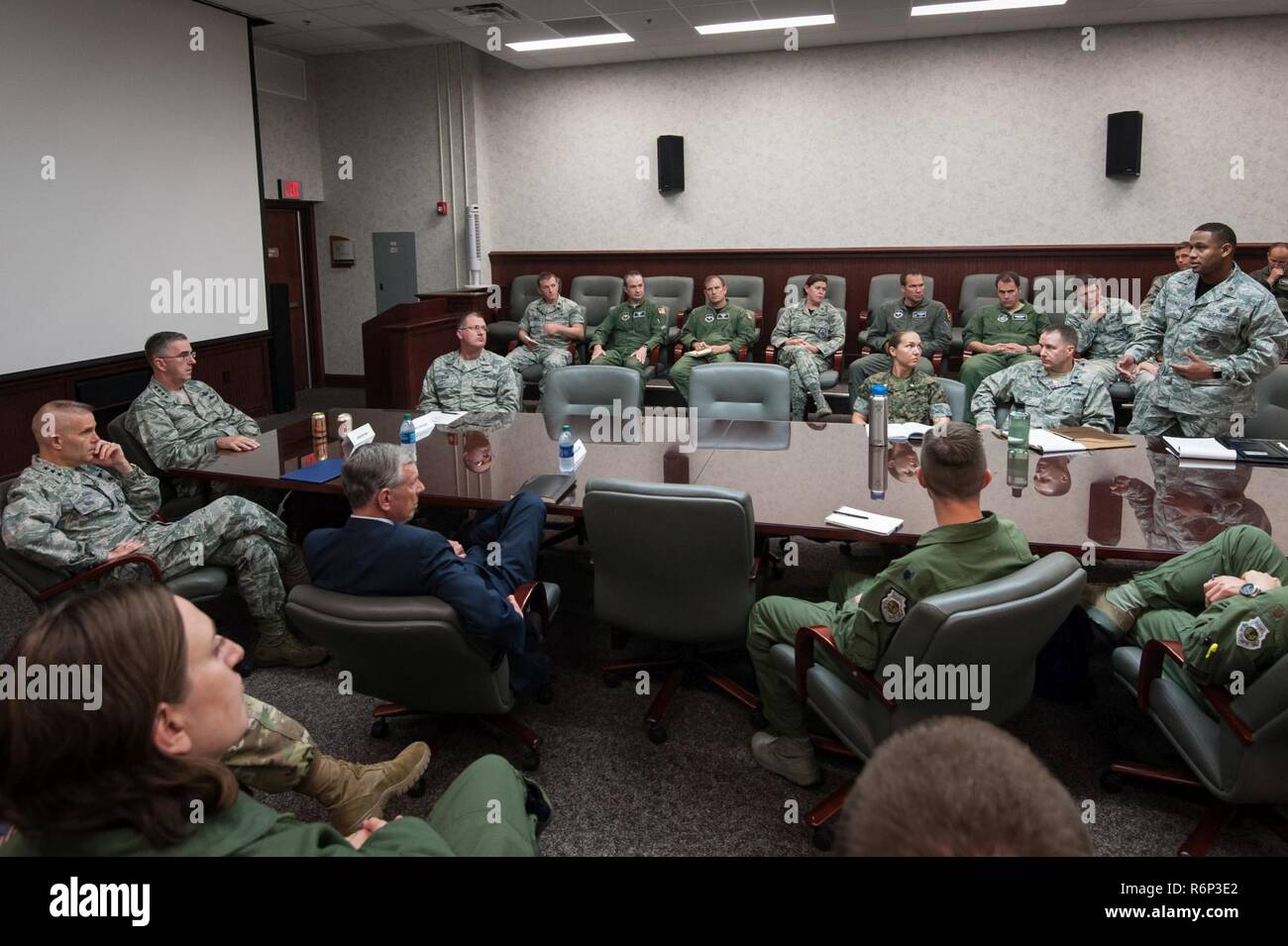 U.S. Air Force Maj. John Wallace (standing right), a student at Air ...
