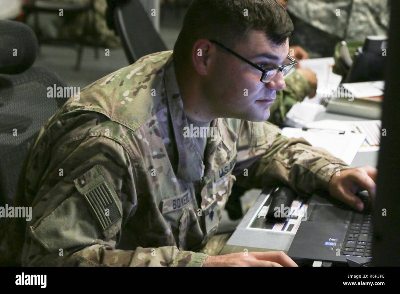 Spc. Robert Bowers monitors his terminal in the Tactical Operations ...