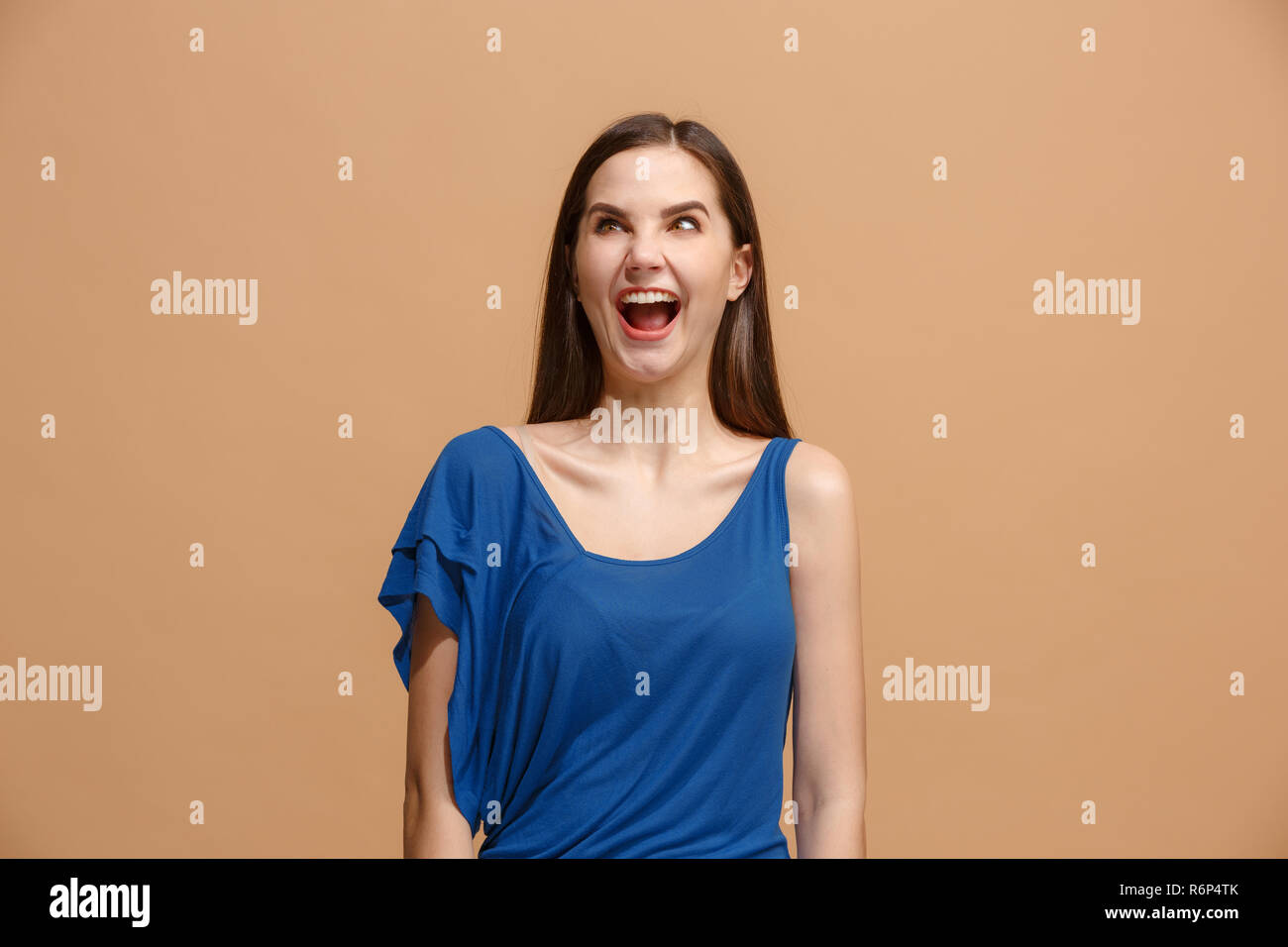 The woman with weird expression isolated on pastel Stock Photo - Alamy