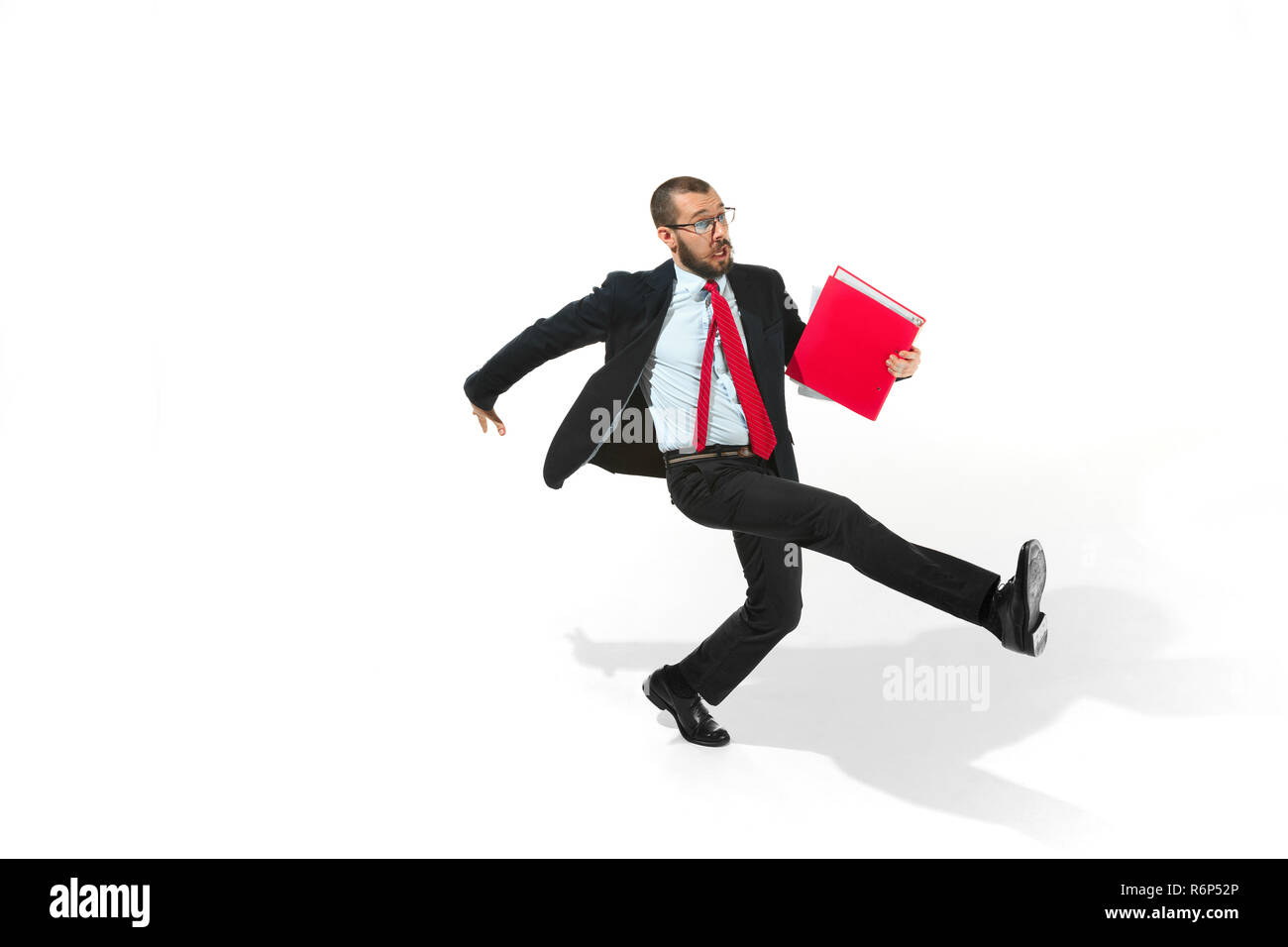 Businessman running with a folder on white background Stock Photo - Alamy